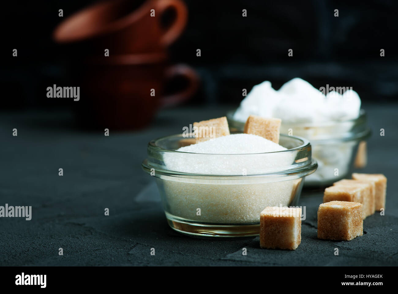 sugar in bowl and on a table Stock Photo - Alamy