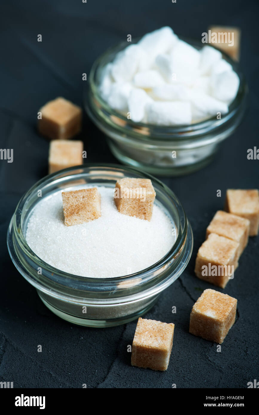 sugar in bowl and on a table Stock Photo - Alamy
