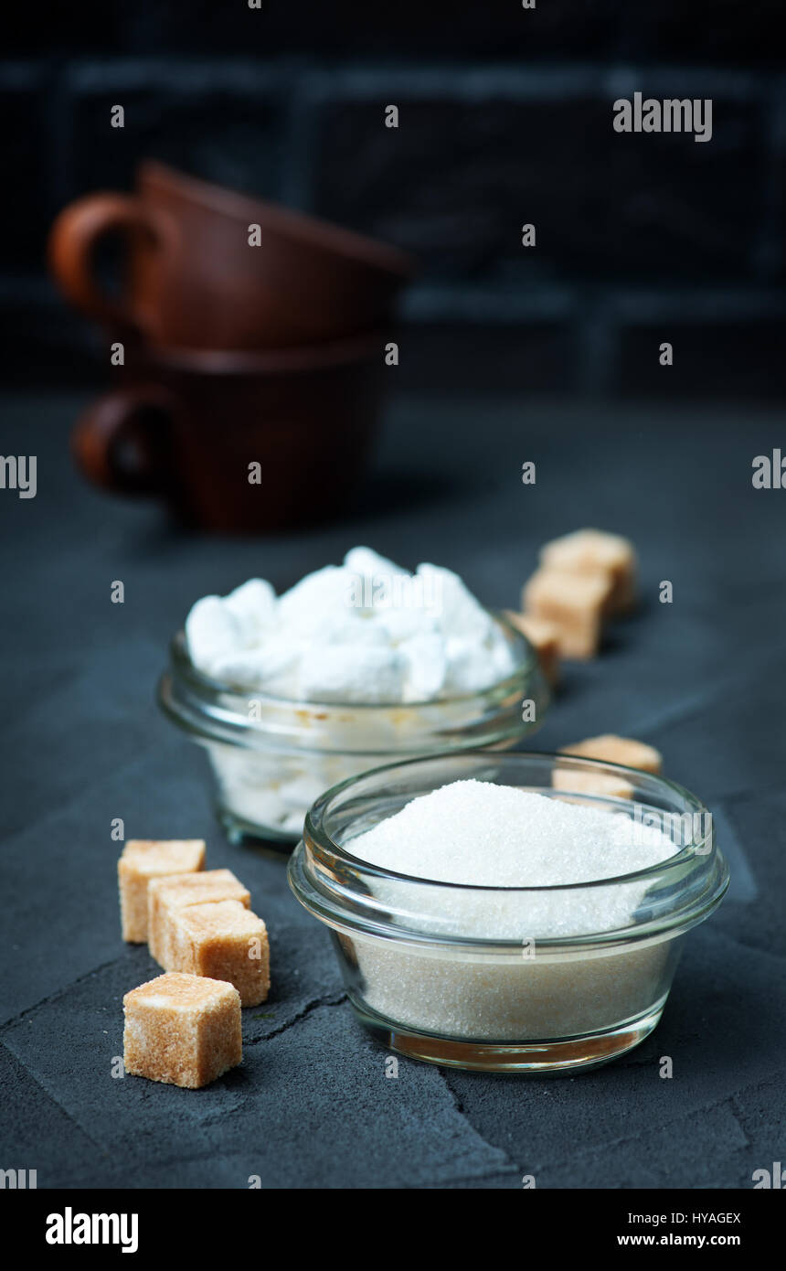 sugar in bowl and on a table Stock Photo - Alamy