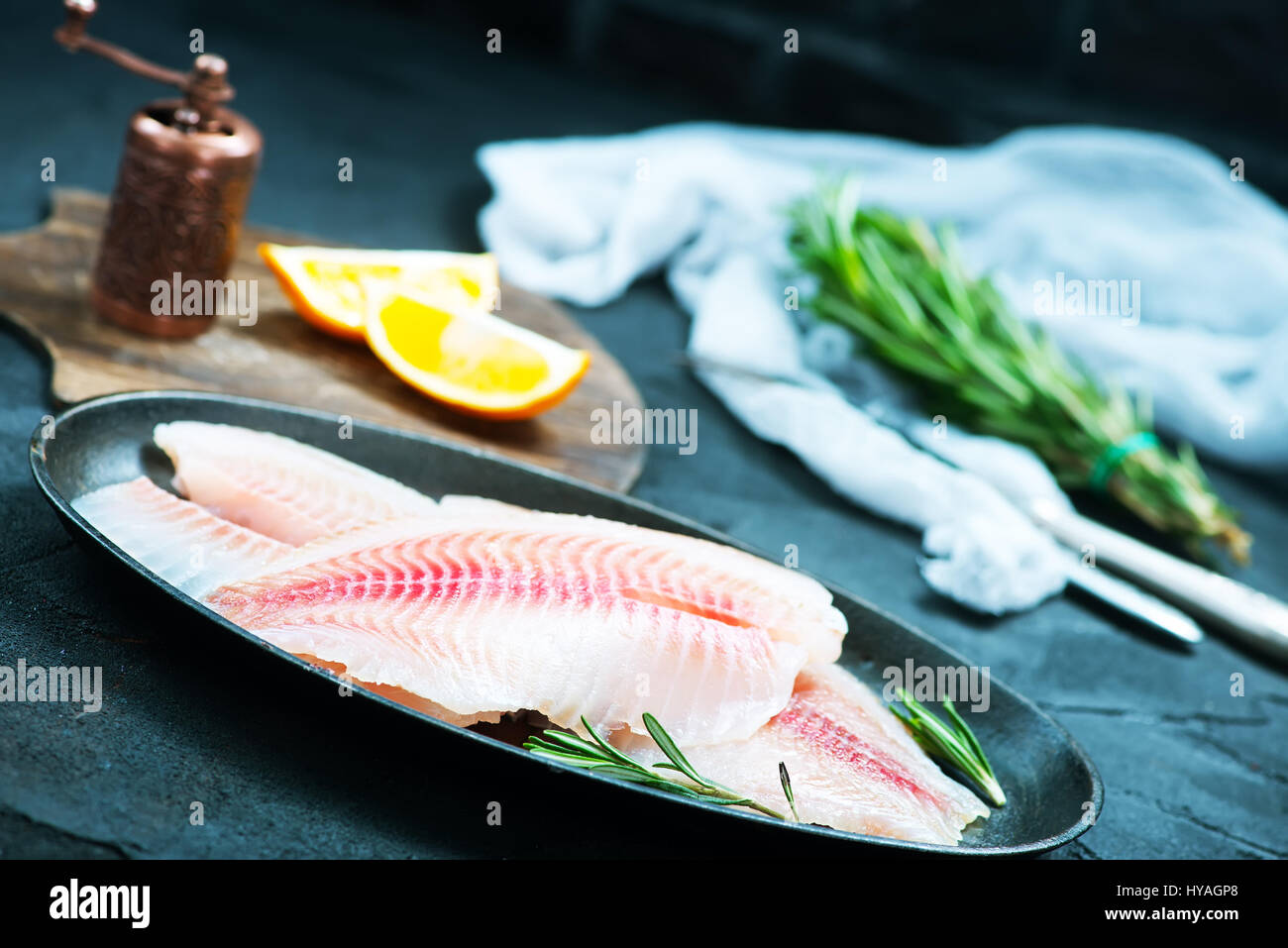 raw fish with spice and on a table Stock Photo - Alamy