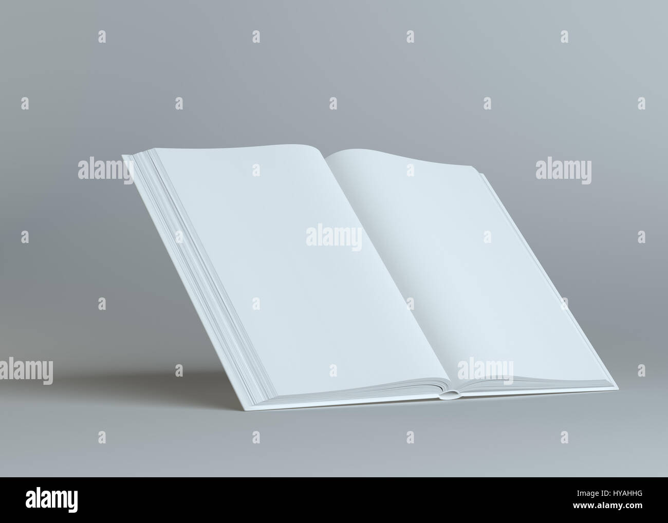 White empty open book on gray background Stock Photo - Alamy