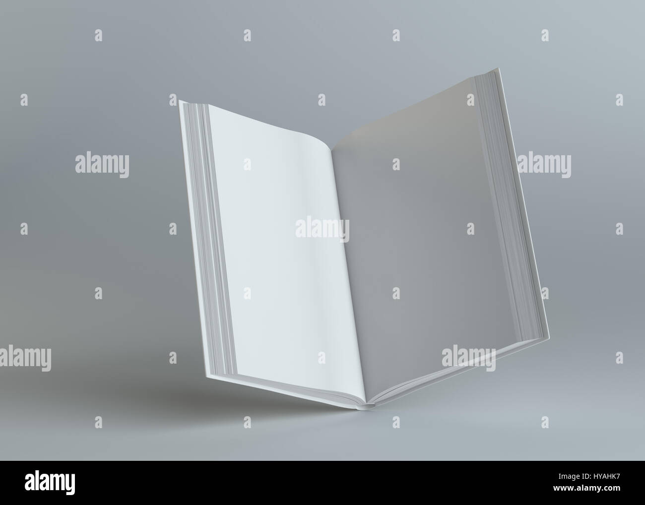 White empty open book on gray background Stock Photo - Alamy