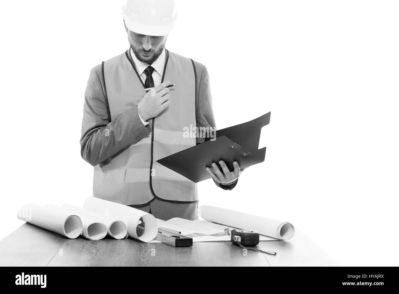 Engineer safety vest hardhat Black and White Stock Photos & Images - Alamy