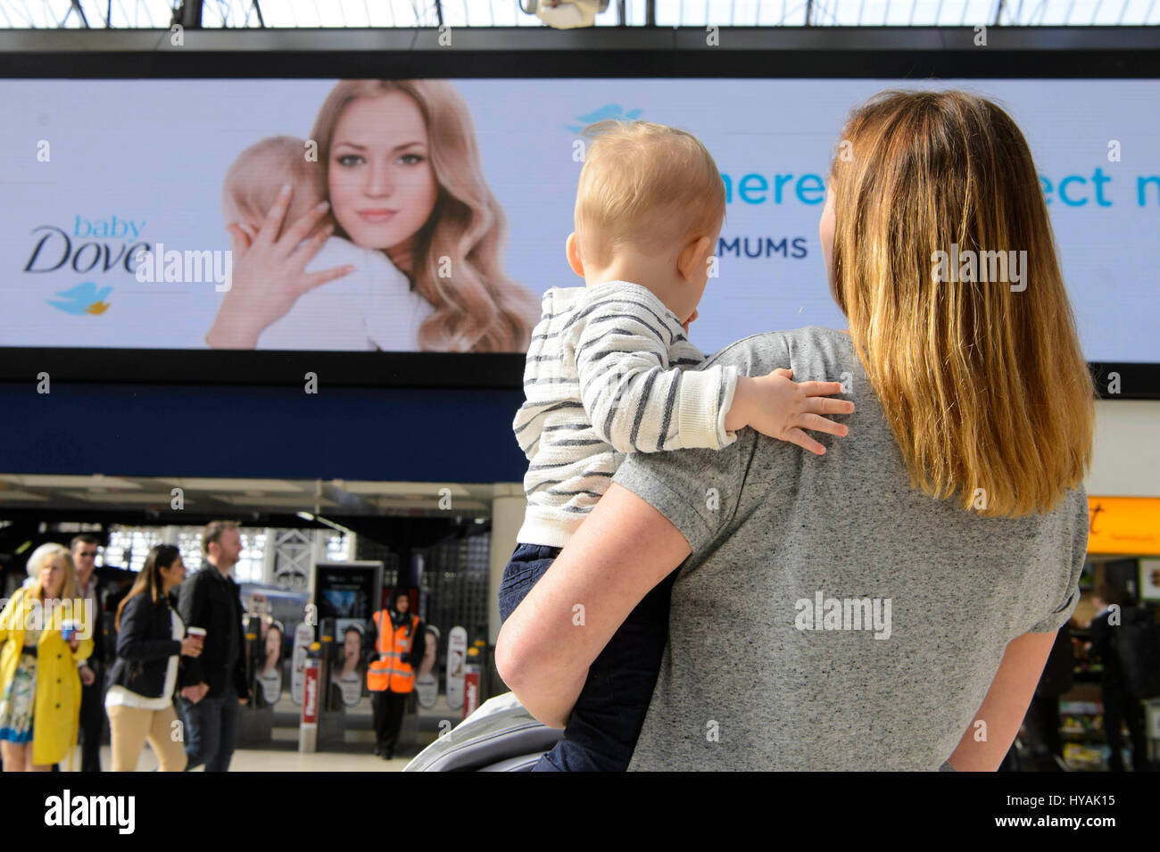 EDITORIAL USE ONLY Mother Tara Hewitt, from Ashtead, looks at a digital ...