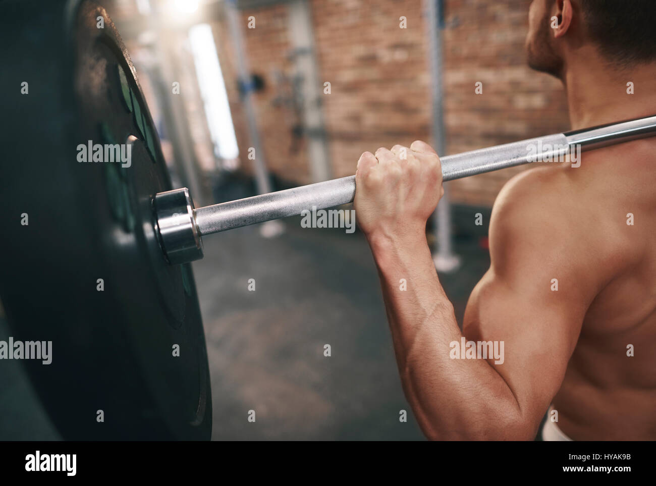 Rear view of man building triceps Stock Photo - Alamy