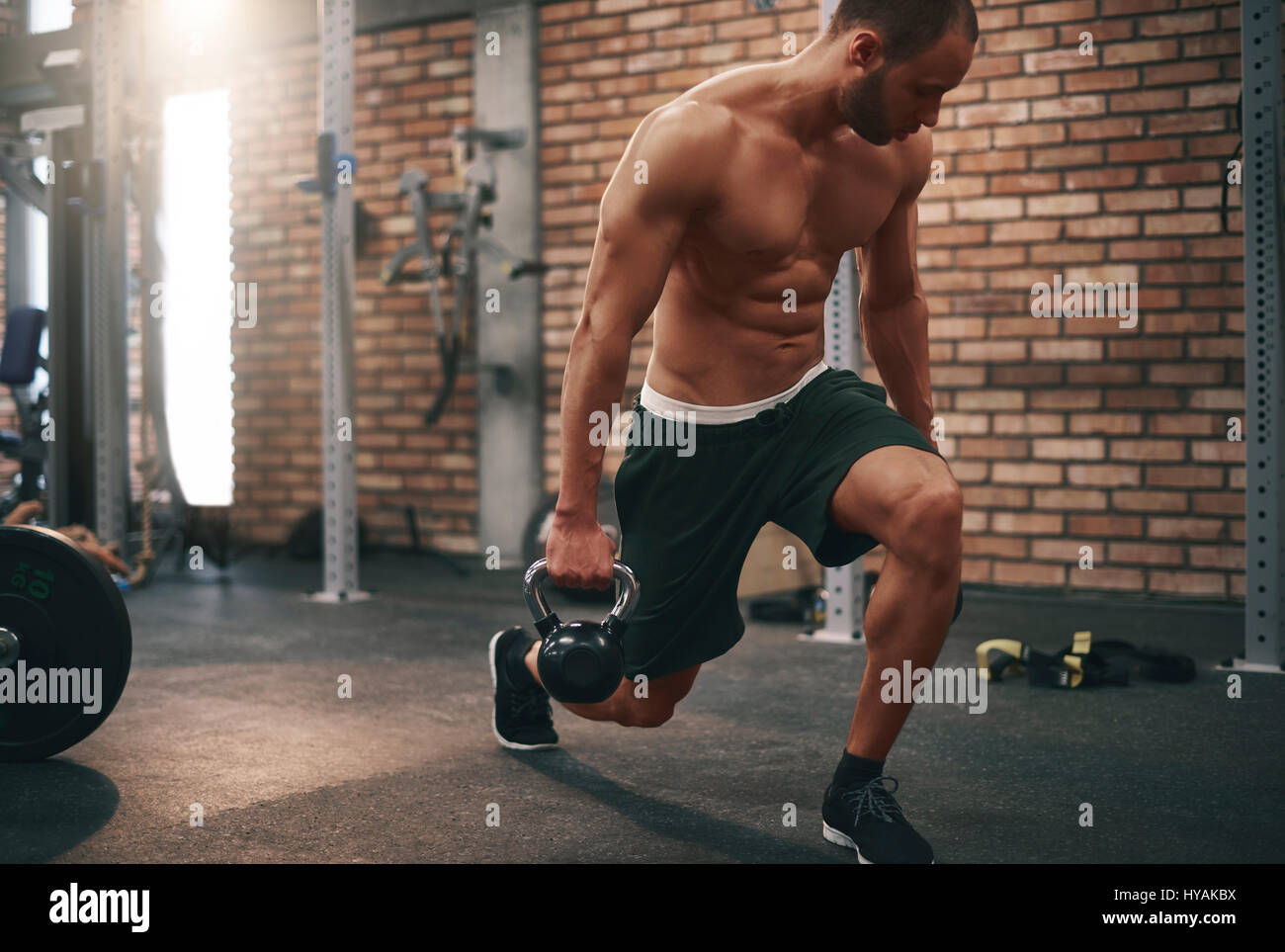 Man working hard at the gym Stock Photo - Alamy