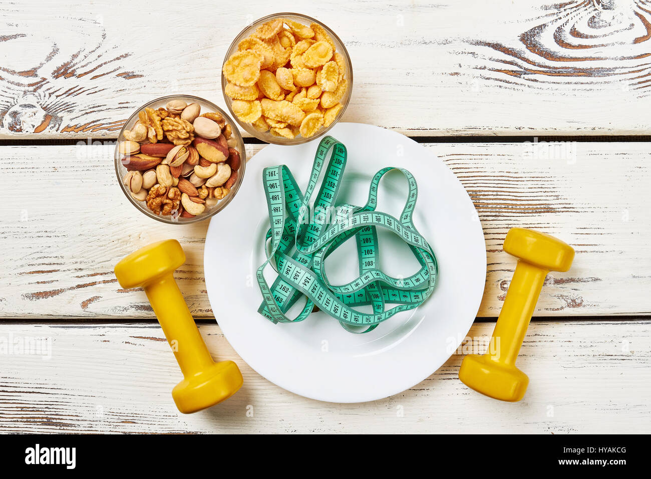 Measuring tape on a plate. Healthy food, happy life Stock Photo - Alamy