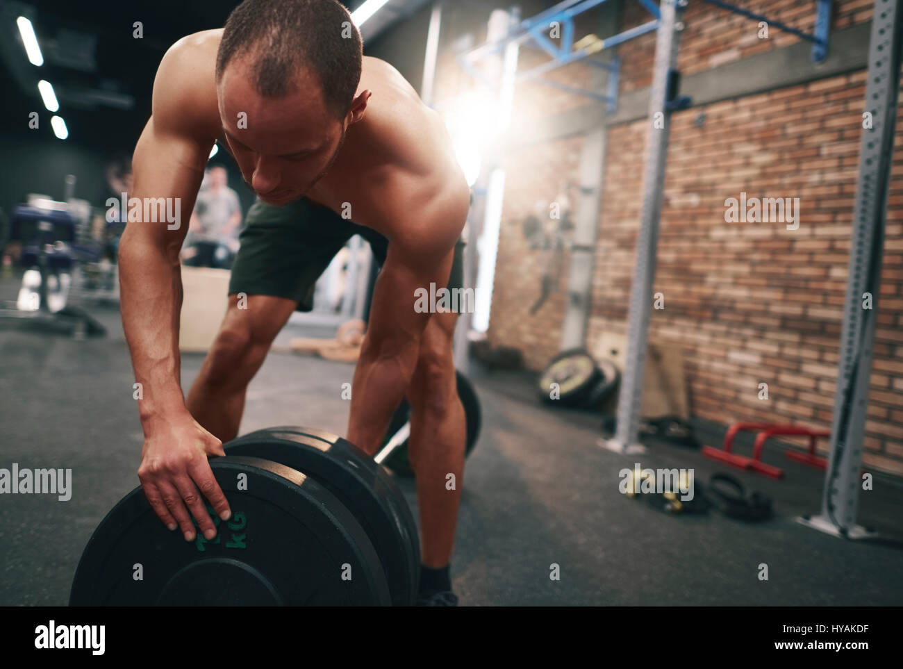 Preparation for the barbell lifting Stock Photo - Alamy