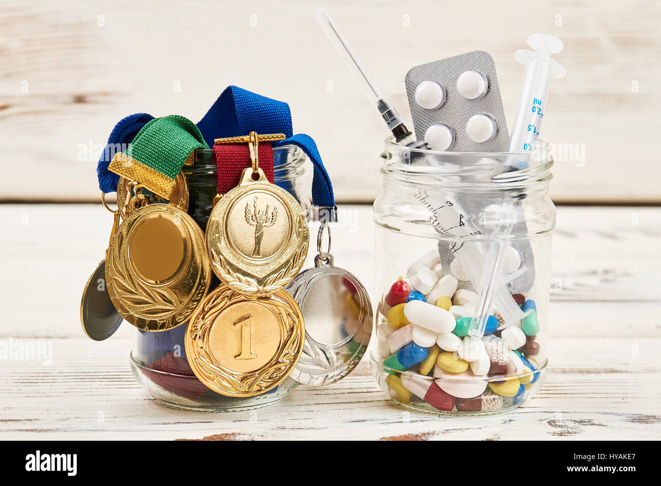 Syringes, medals and pills Stock Photo - Alamy