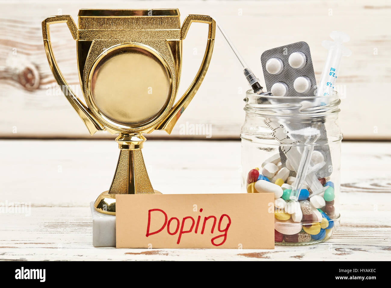 Syringe, pills and award Stock Photo - Alamy