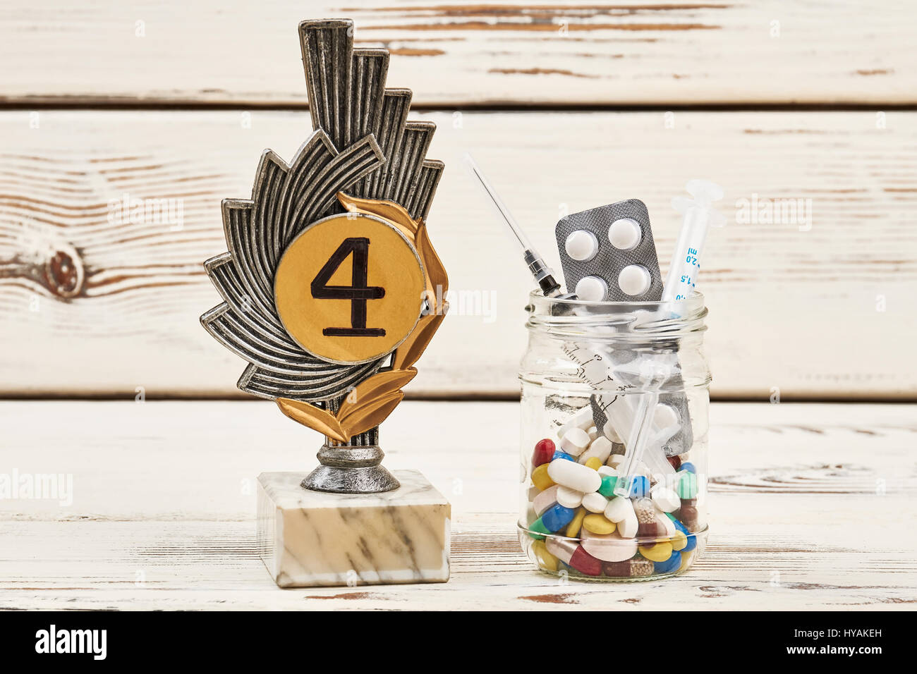 Award and pills on wood Stock Photo - Alamy