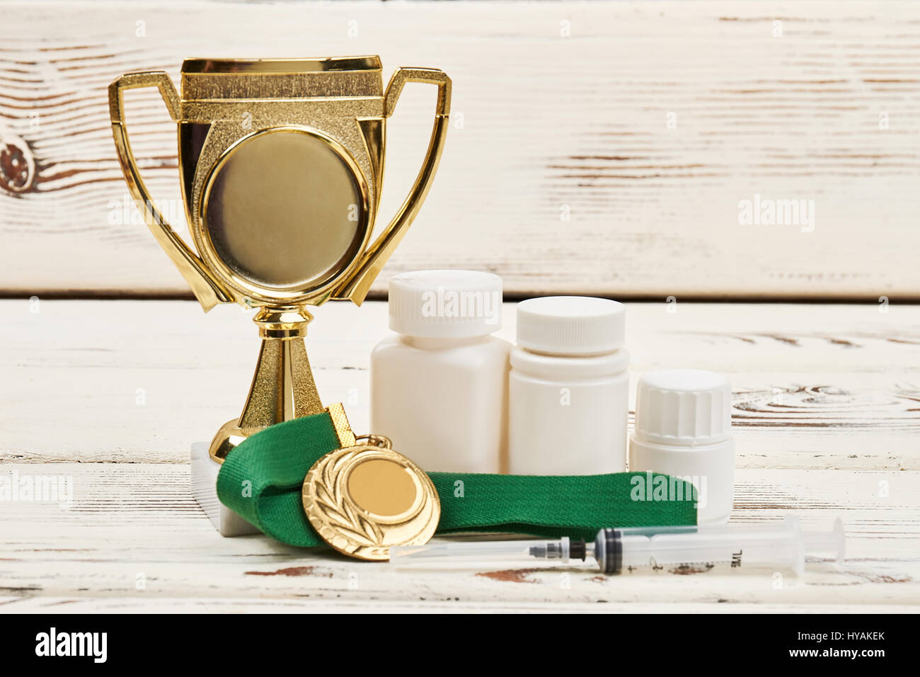 Cup, medal and pills Stock Photo - Alamy