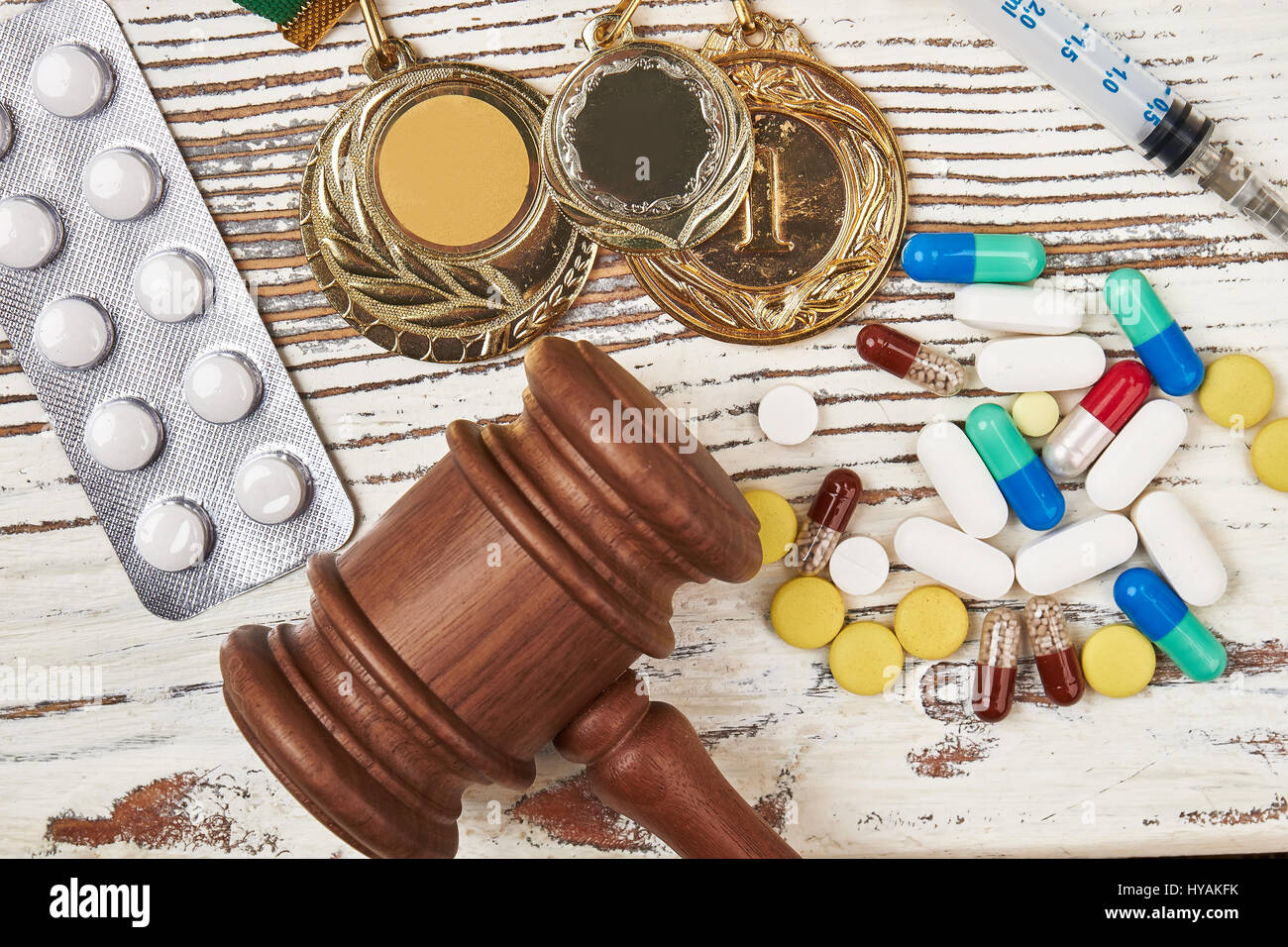 Hammer, medals, syringe and pills Stock Photo - Alamy
