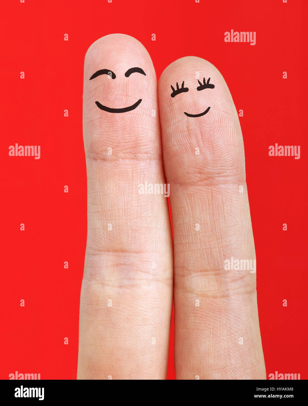 Painted happy fingers smiley faces in love Stock Photo - Alamy
