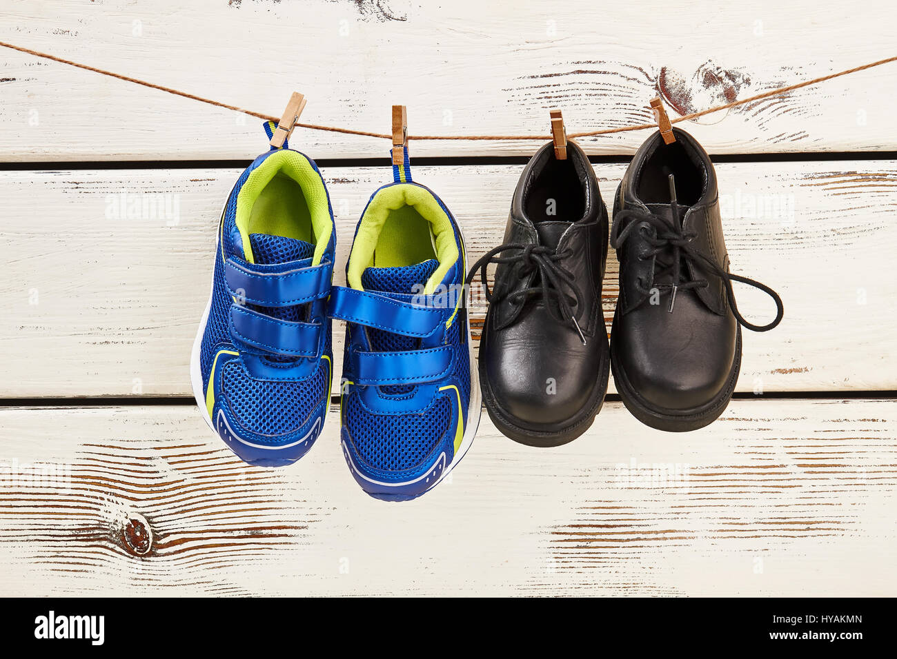 Shoes hanging on clothesline Stock Photo - Alamy