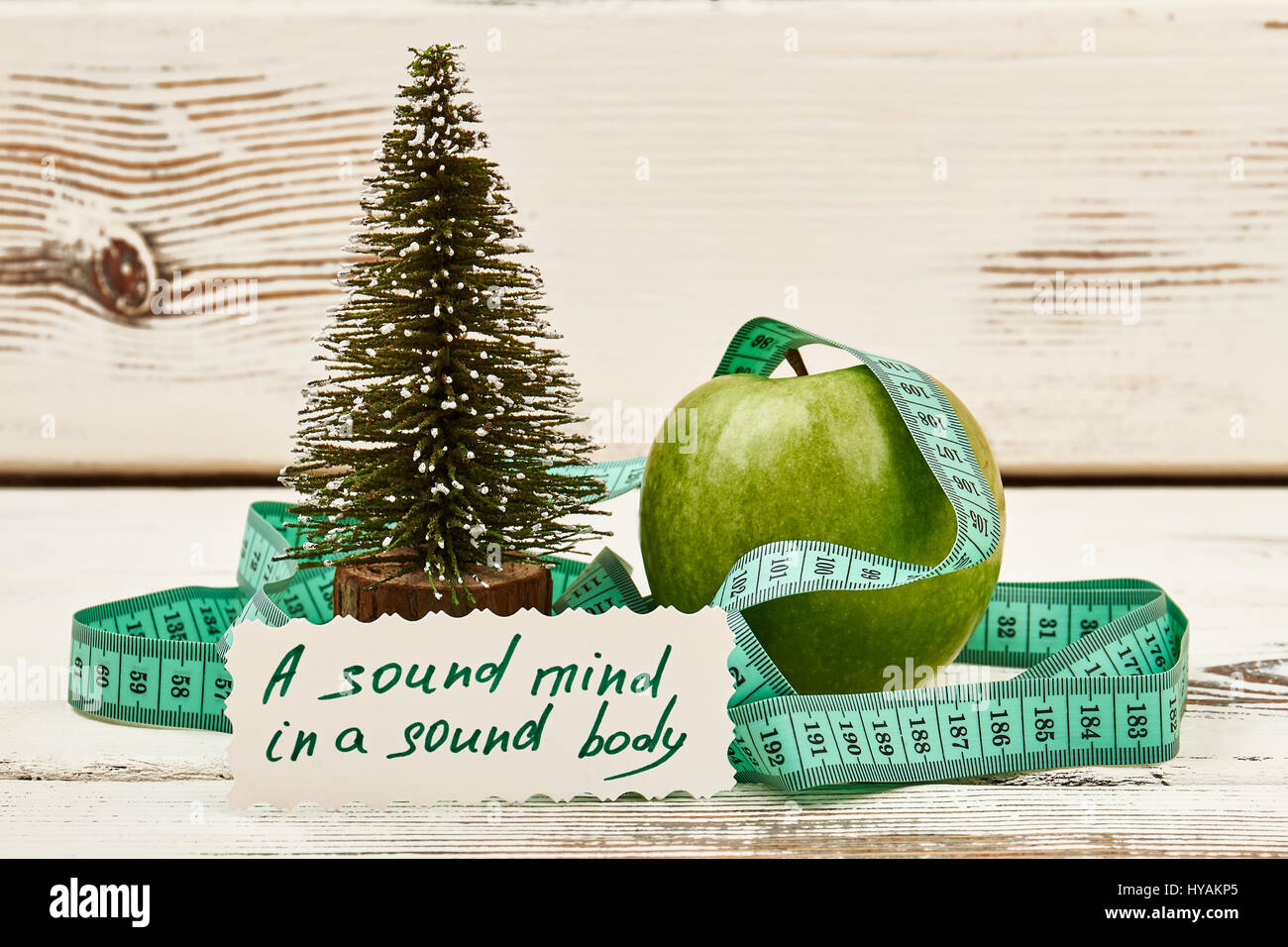 Fir-tree, apple and proverb Stock Photo - Alamy