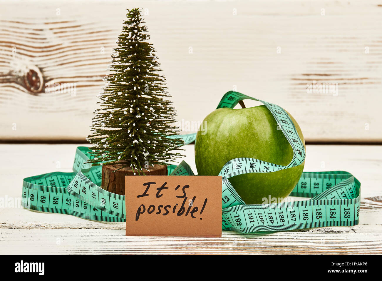 Fir-tree and apple on wood Stock Photo - Alamy