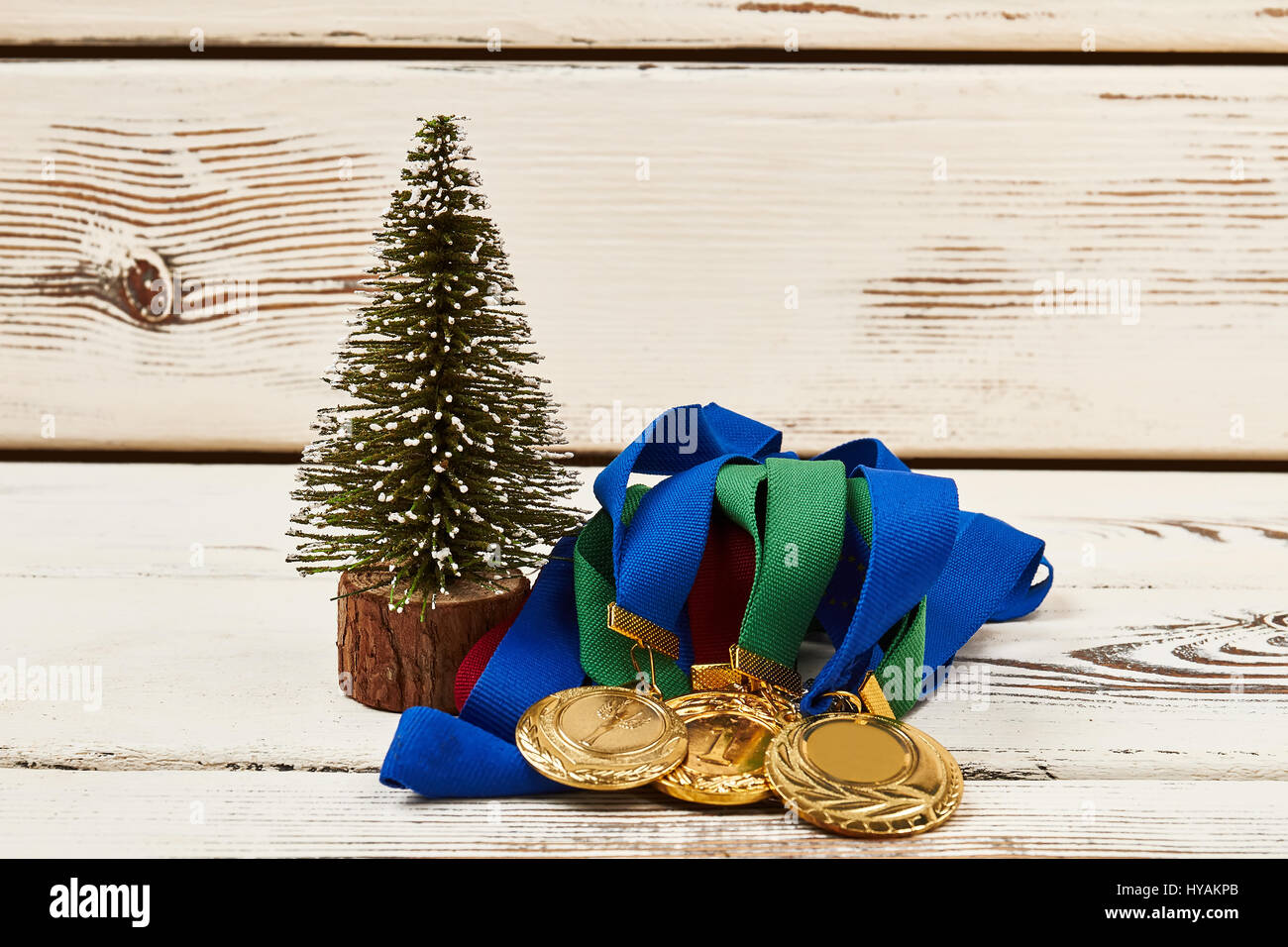 Medals and fir-tree on wood Stock Photo - Alamy