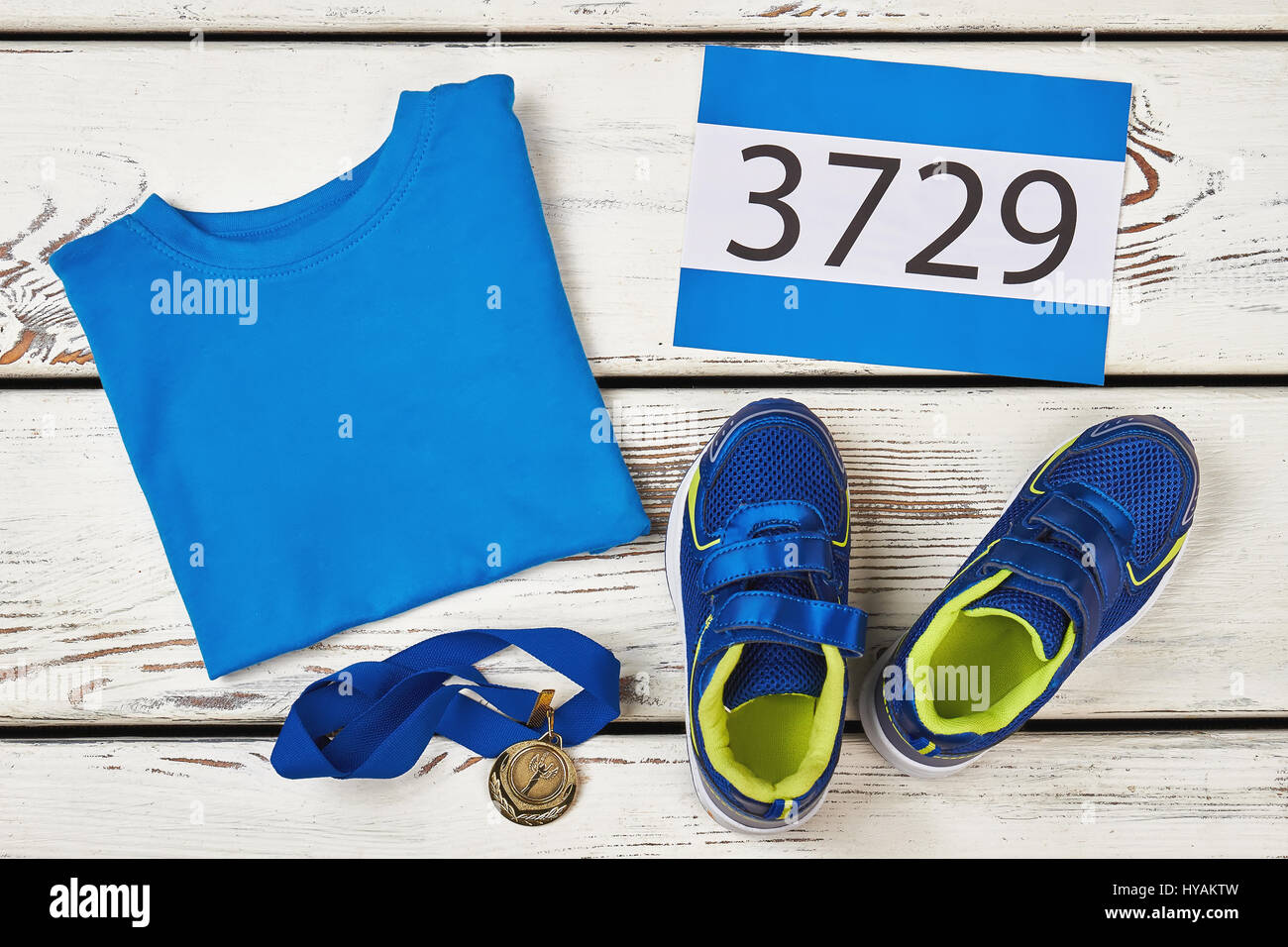 T-shirt, sneakers and participant number Stock Photo - Alamy