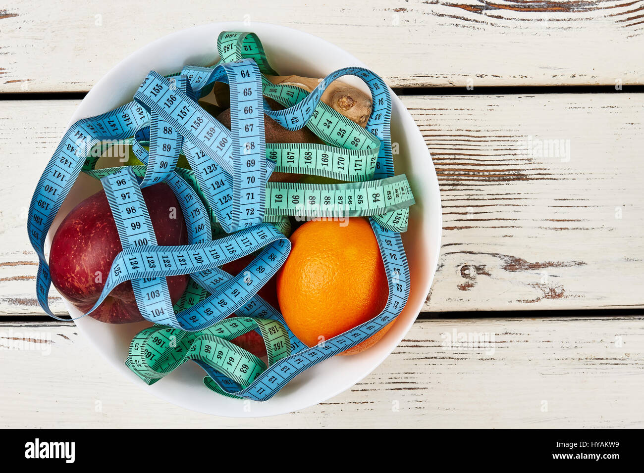 Fruits and measuring tape Stock Photo - Alamy