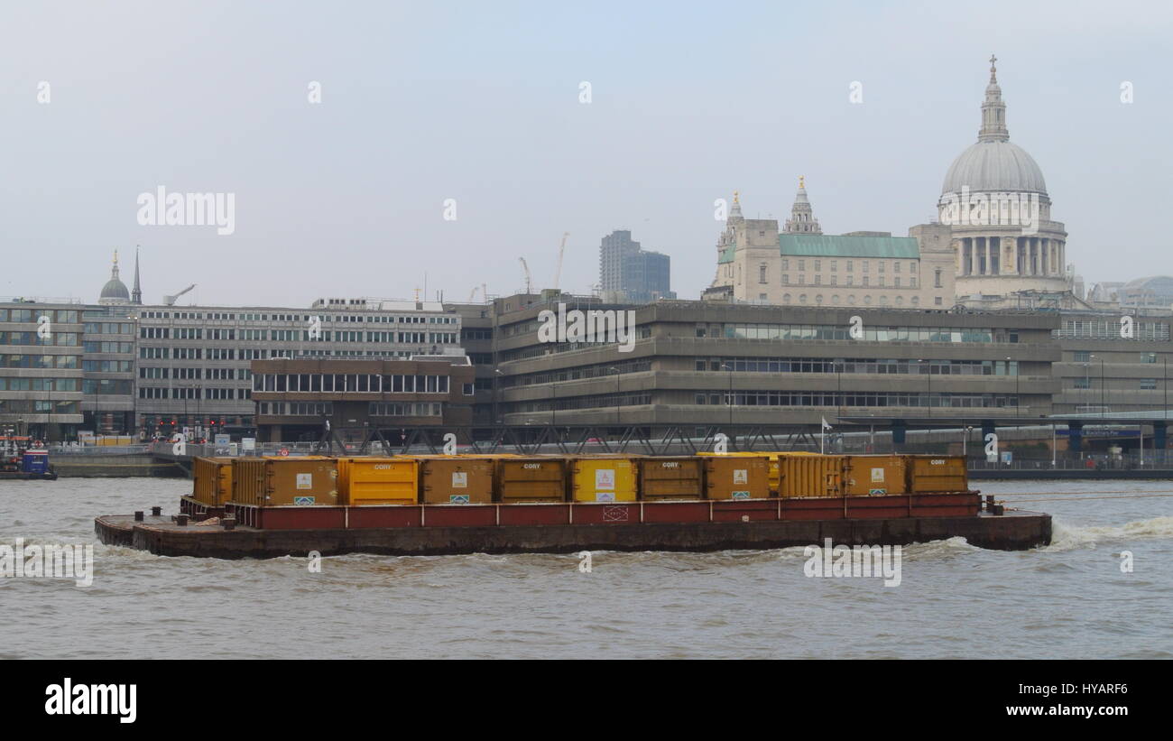 Tugboat Regain towing barge with containers full of waste / refuse ...