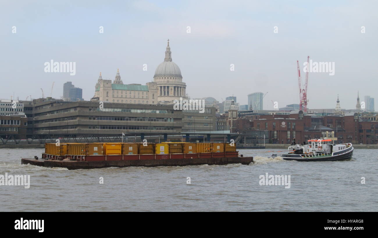 Tug boat towing waste containers hi-res stock photography and images ...