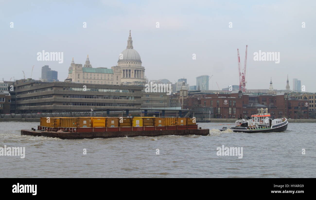 Tug boat towing waste containers hi-res stock photography and images ...