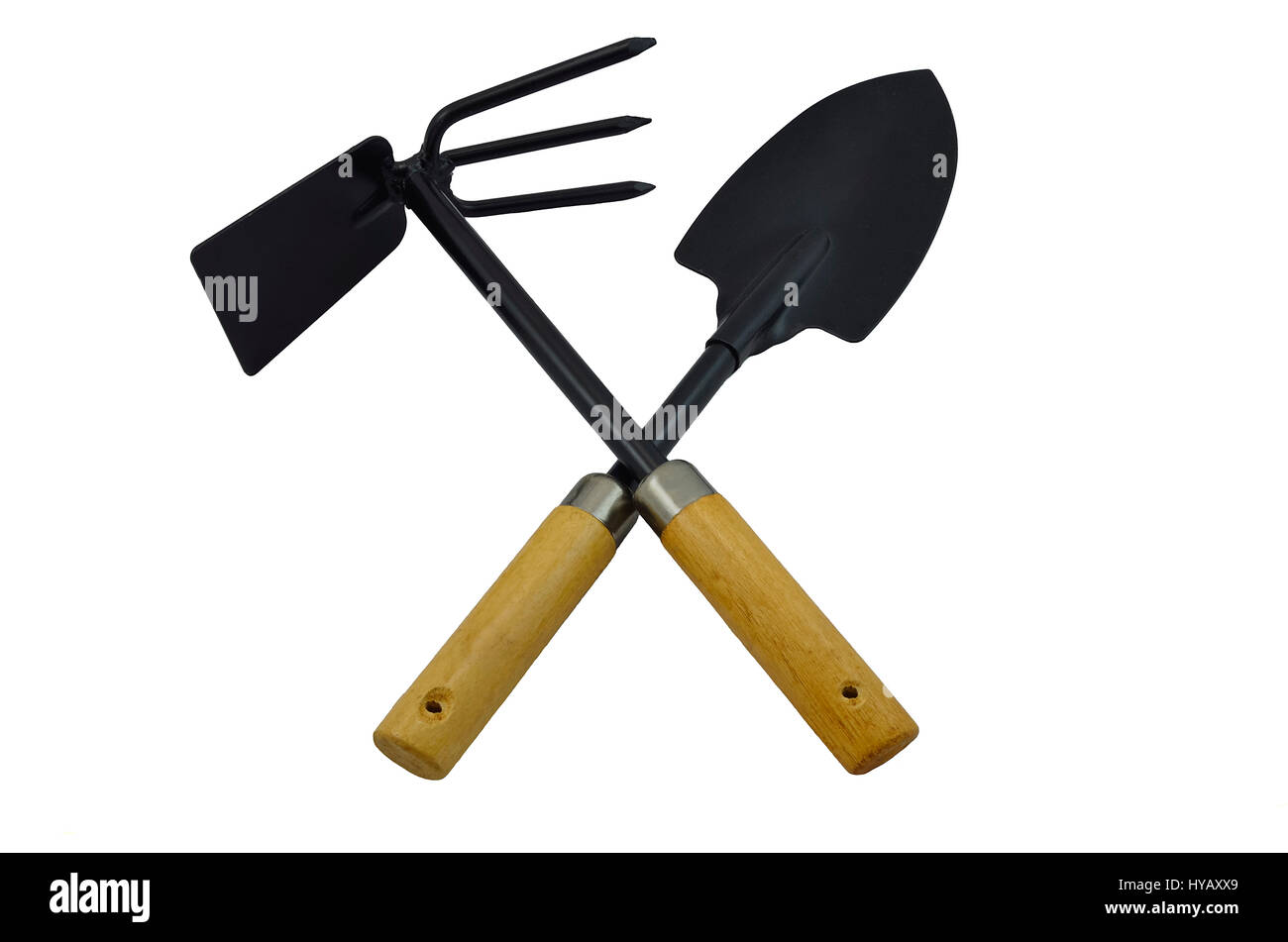 A spade and a rake isolated on white background Stock Photo - Alamy