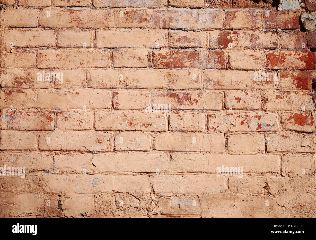 Old painted, scratched brick wall, red Stock Photo - Alamy