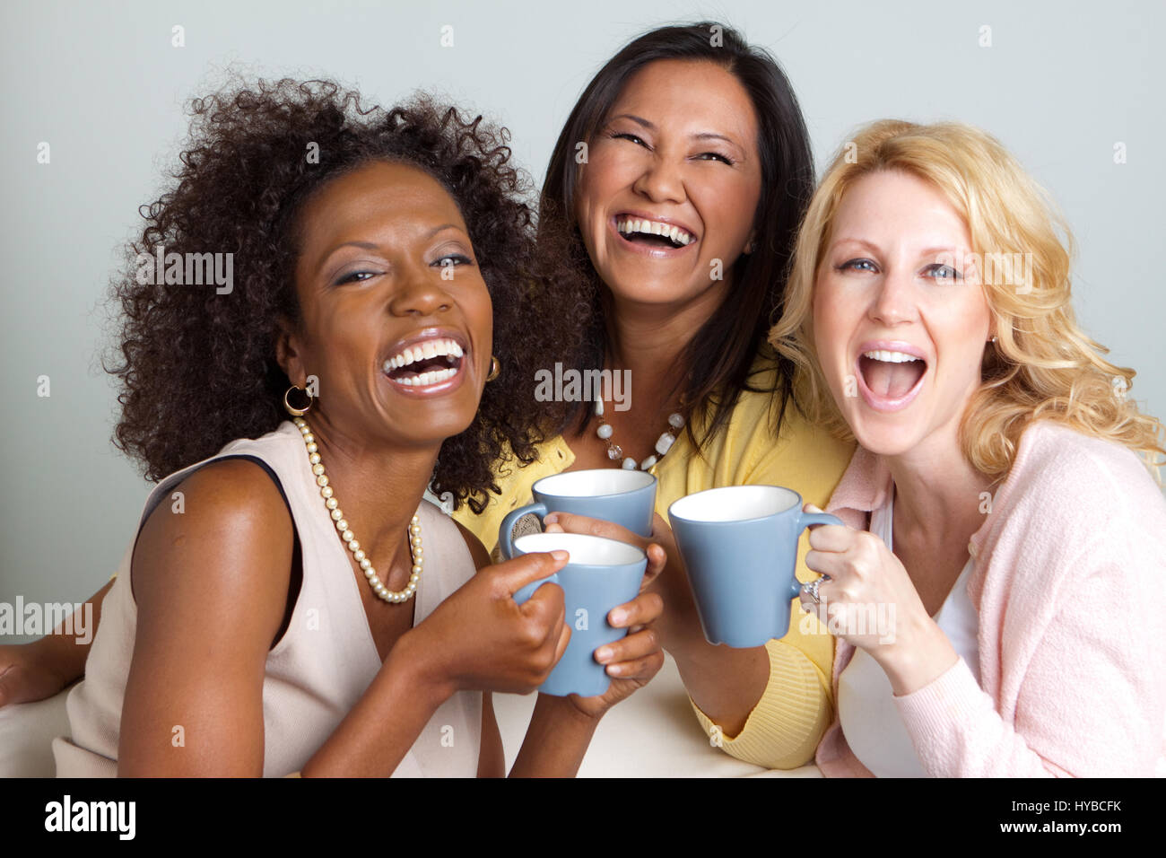 Diverse group of friends talking and laughing Stock Photo - Alamy