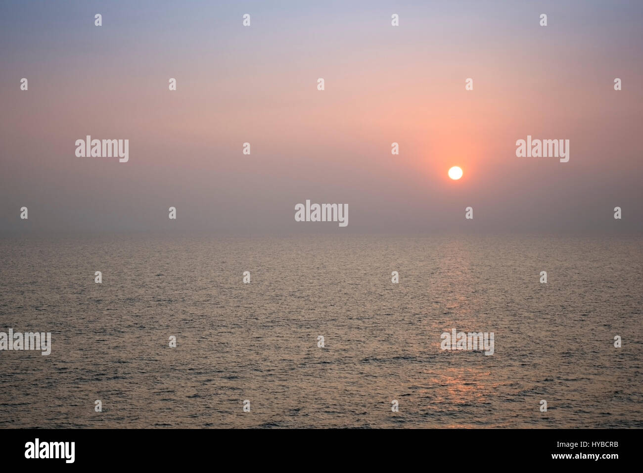 Sunset over the sea Stock Photo - Alamy