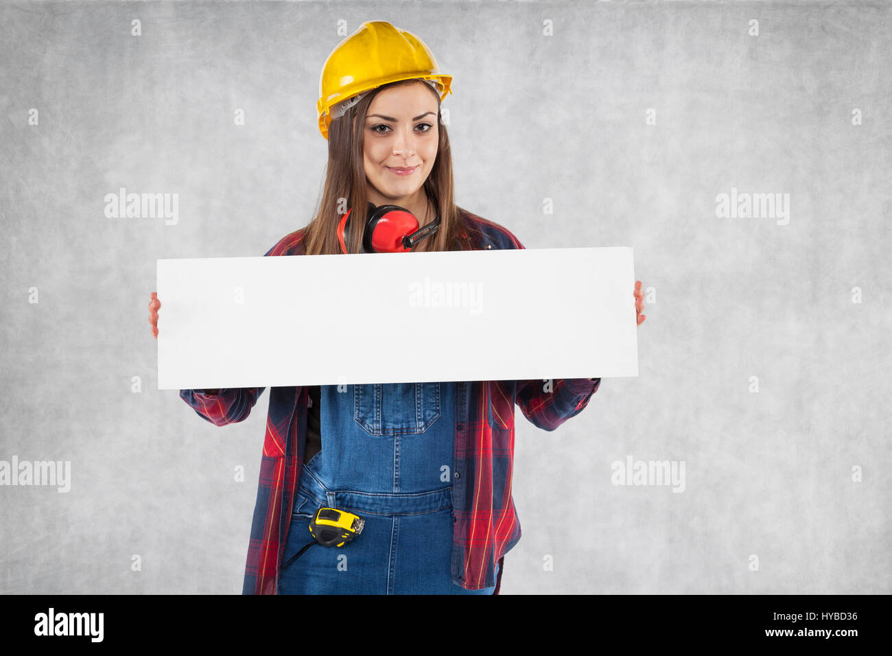 Adorable worker woman with advertising banner Stock Photo - Alamy