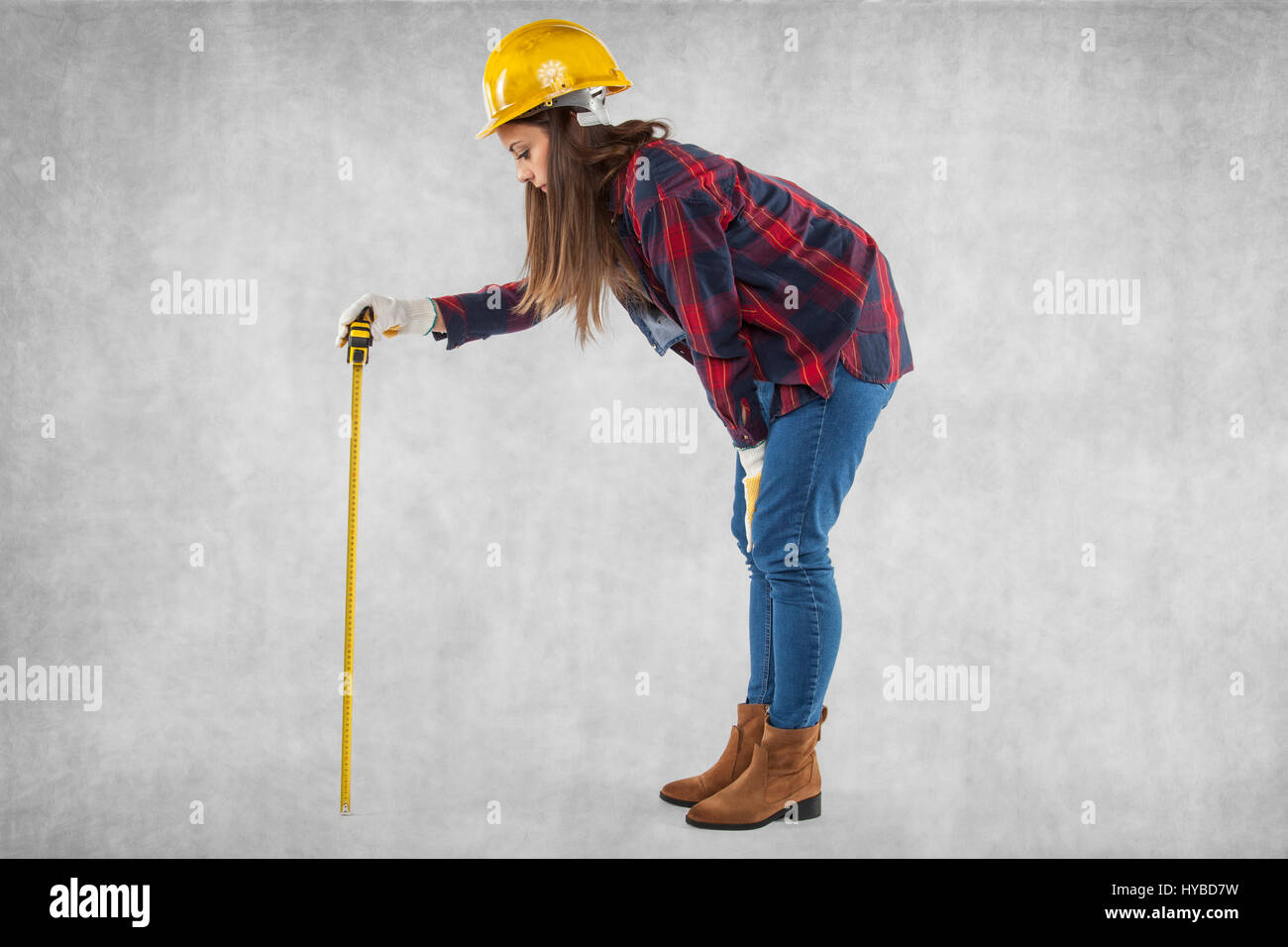 Construction worker leaning, copy space next to the meter Stock Photo ...