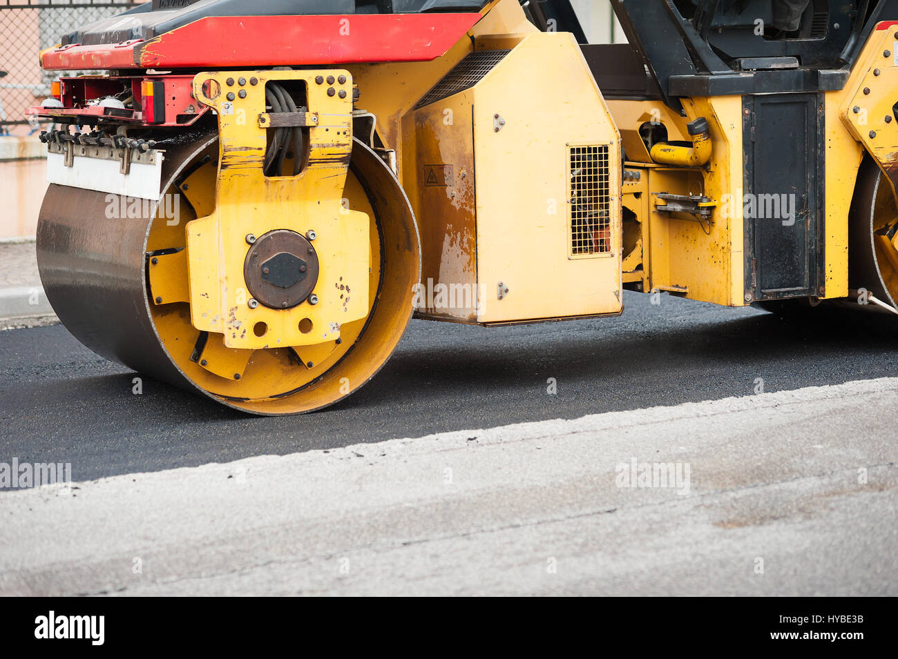 Road roller at work. Work of asphalting a road Stock Photo - Alamy