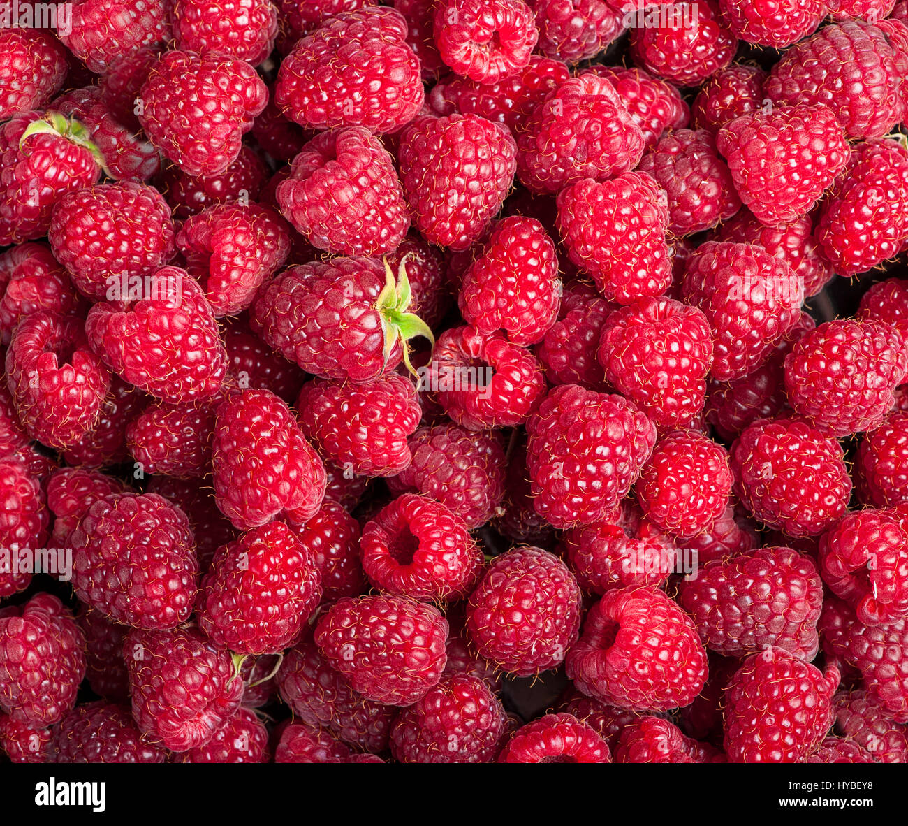 Many sweet fresh raspberry fruit closeup view background Stock Photo ...