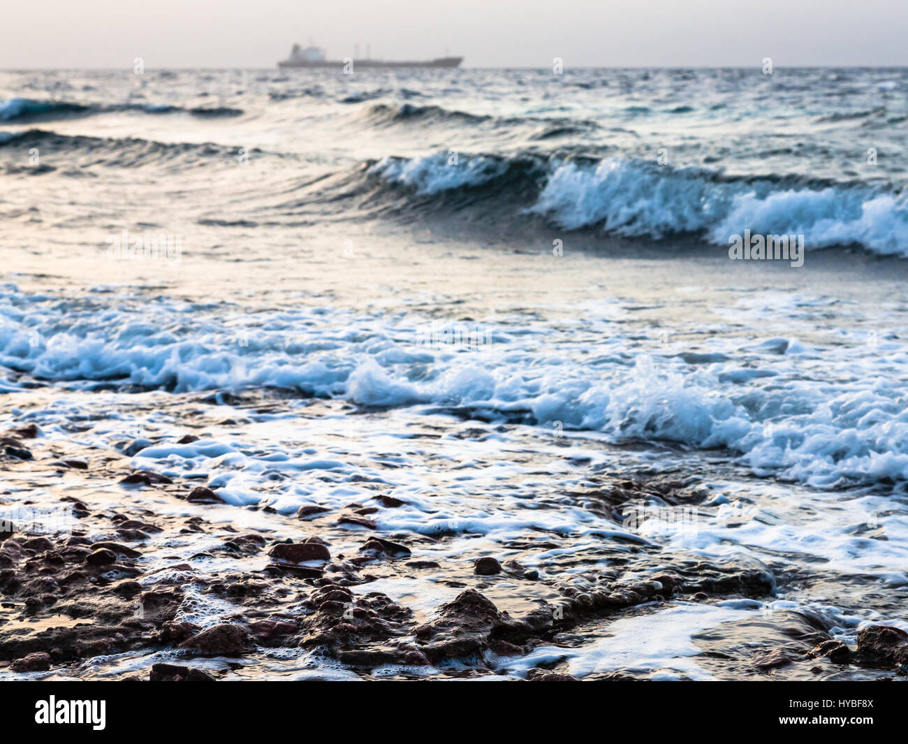 Travel to Middle East country Kingdom of Jordan - surf on shore of Gulf ...