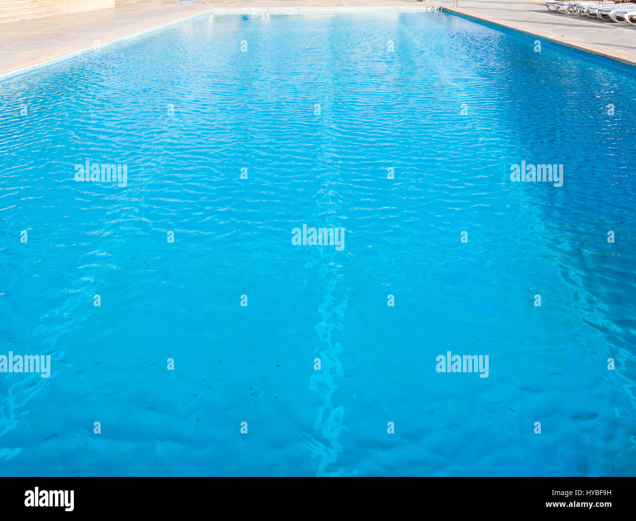 surface of empty outdoor swimming pool with blue water Stock Photo - Alamy