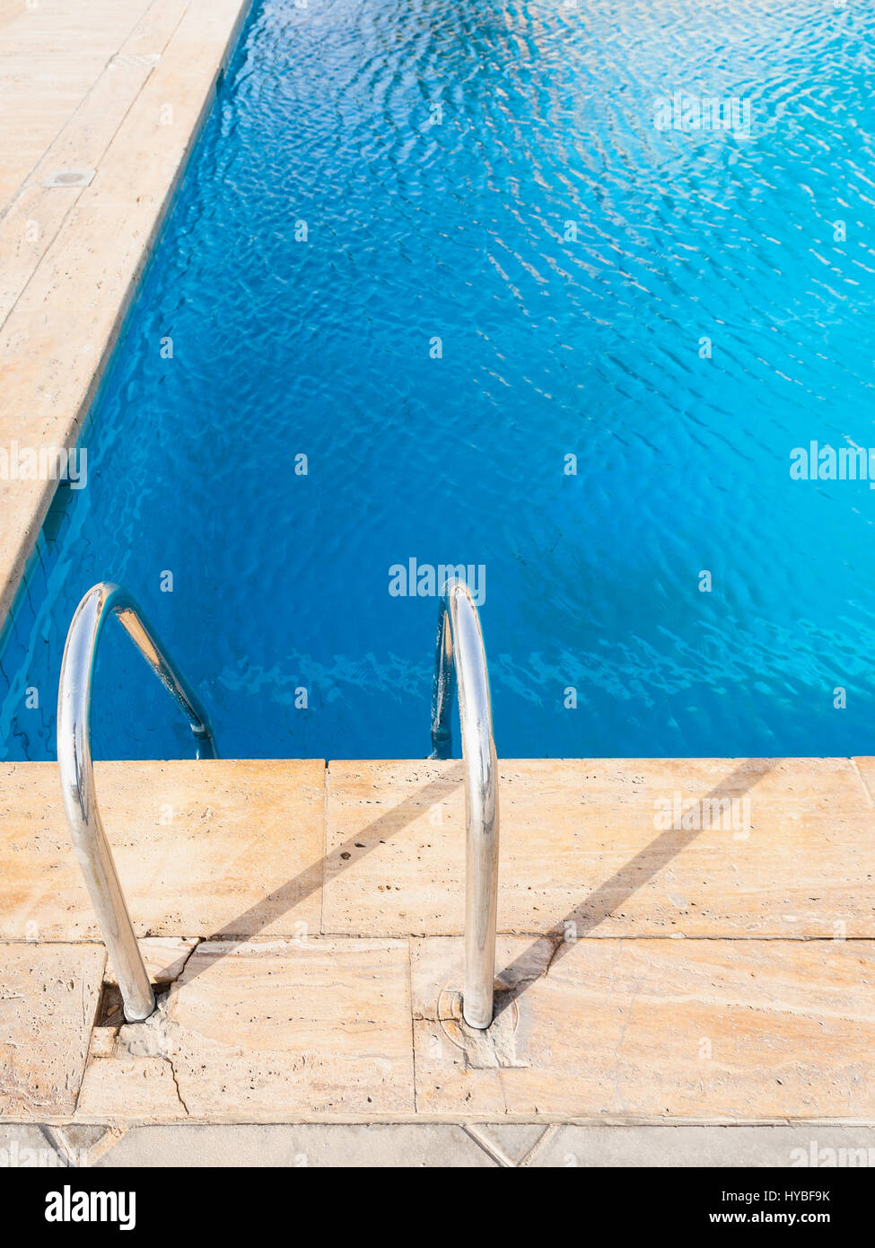 empty outdoor swimming pool with blue water Stock Photo - Alamy