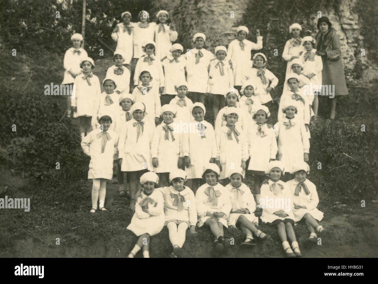 Girl school class photo with white apron, Italy 1932 Stock Photo - Alamy