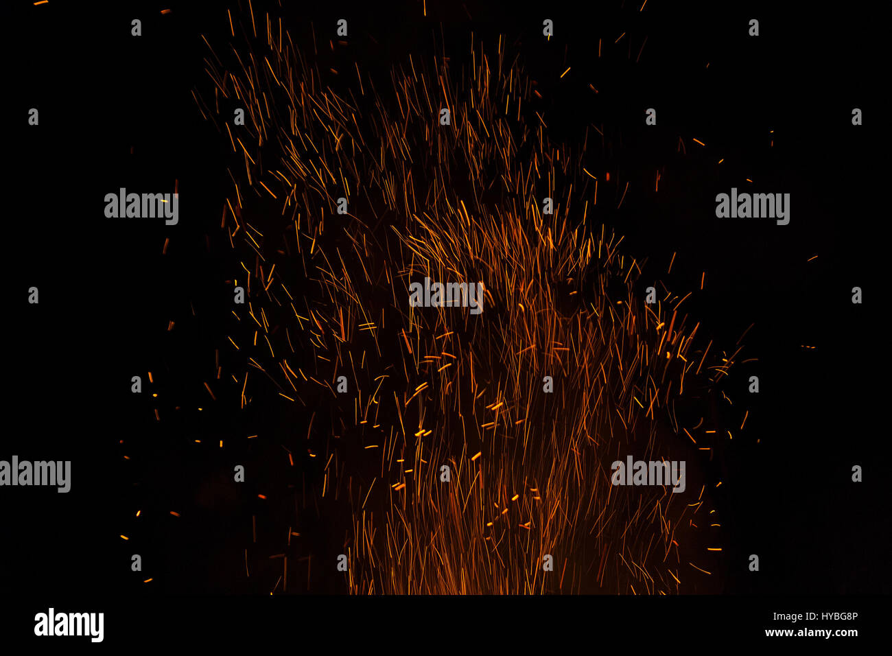 Photo of hot sparking live-coals burning, spark of bonfire Stock Photo ...