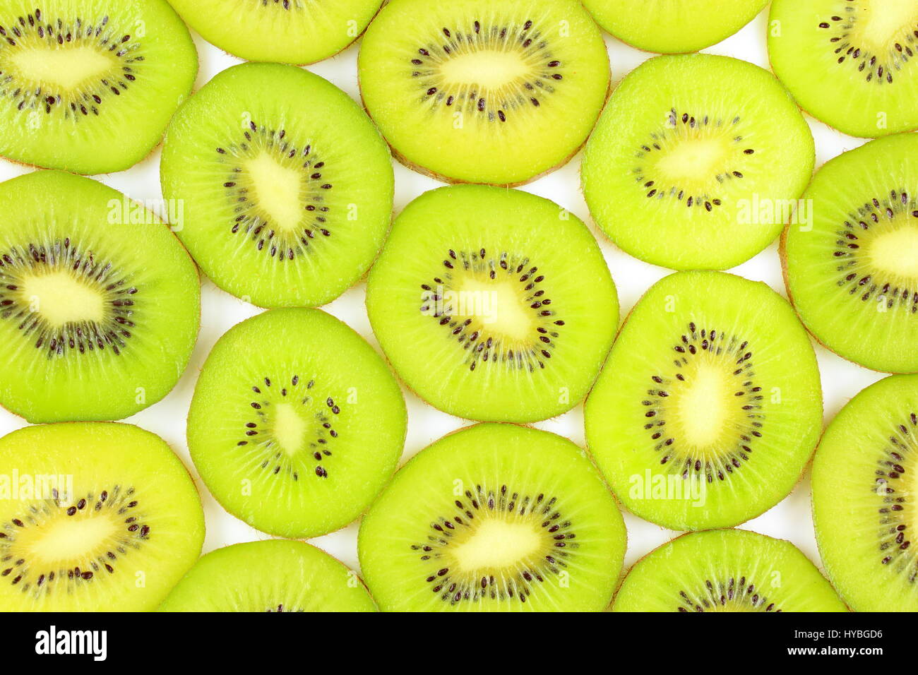 slices of fresh green kiwi fruits as a food background texture Stock ...