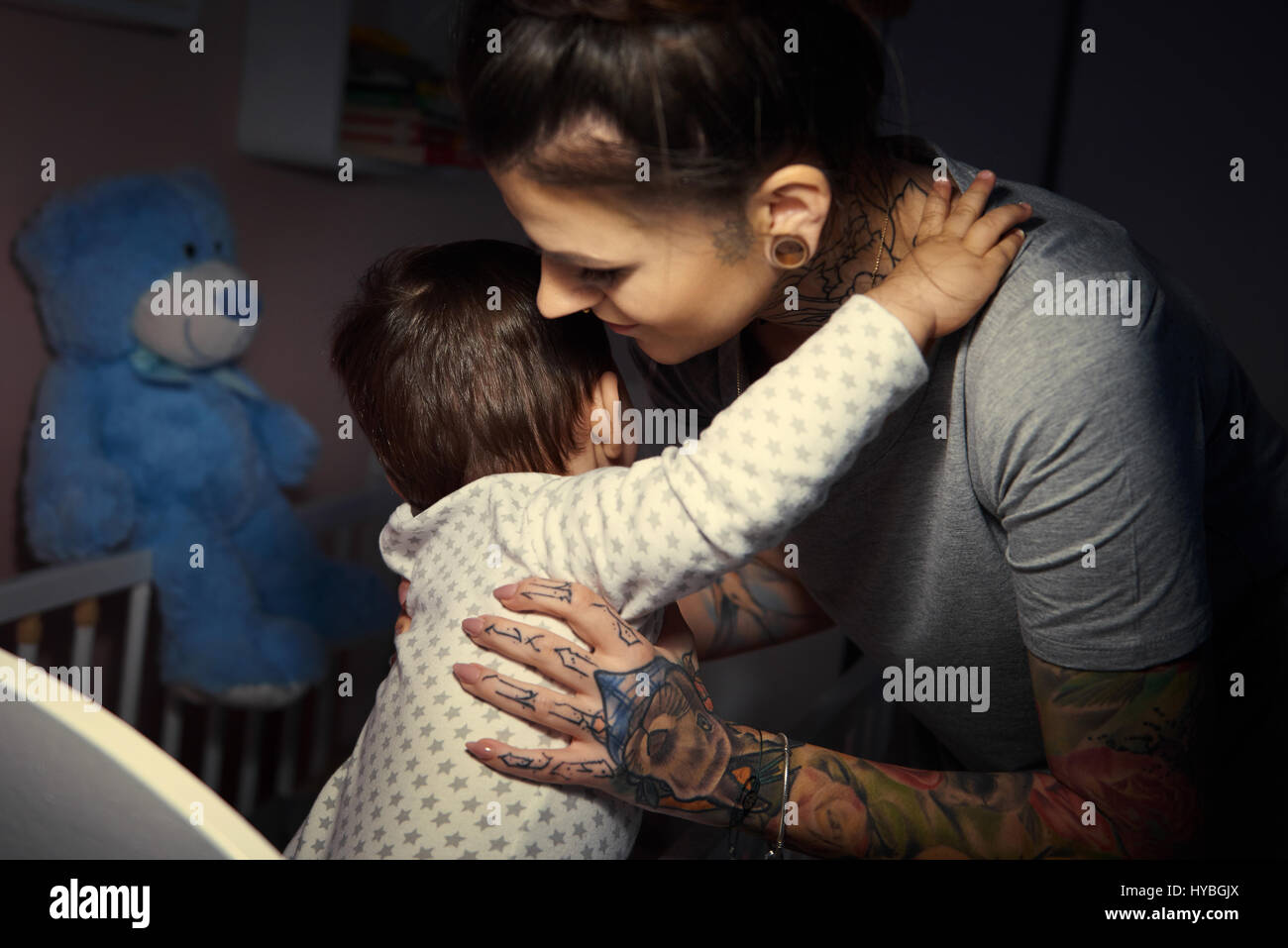 Mummy telling lullaby before sleep Stock Photo - Alamy