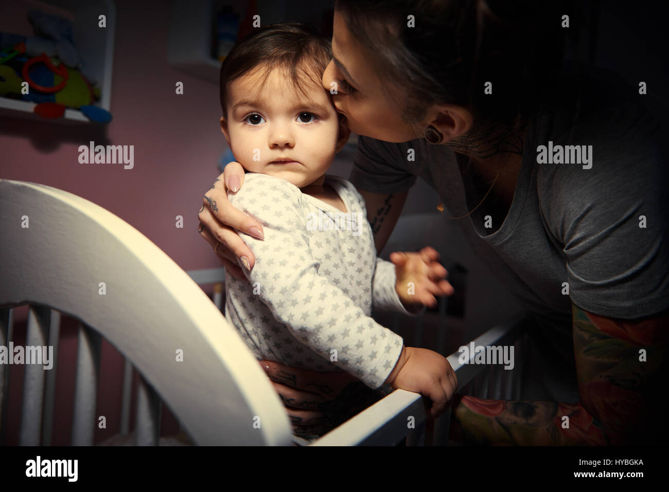 Loving mummy kissing sons forehead Stock Photo - Alamy