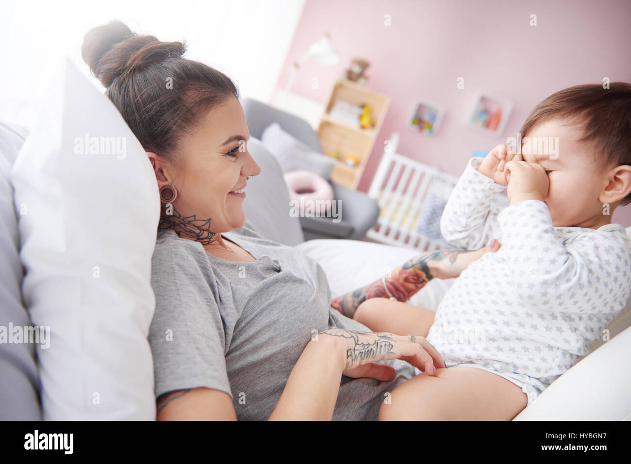 Shot of mother looking after her son Stock Photo - Alamy
