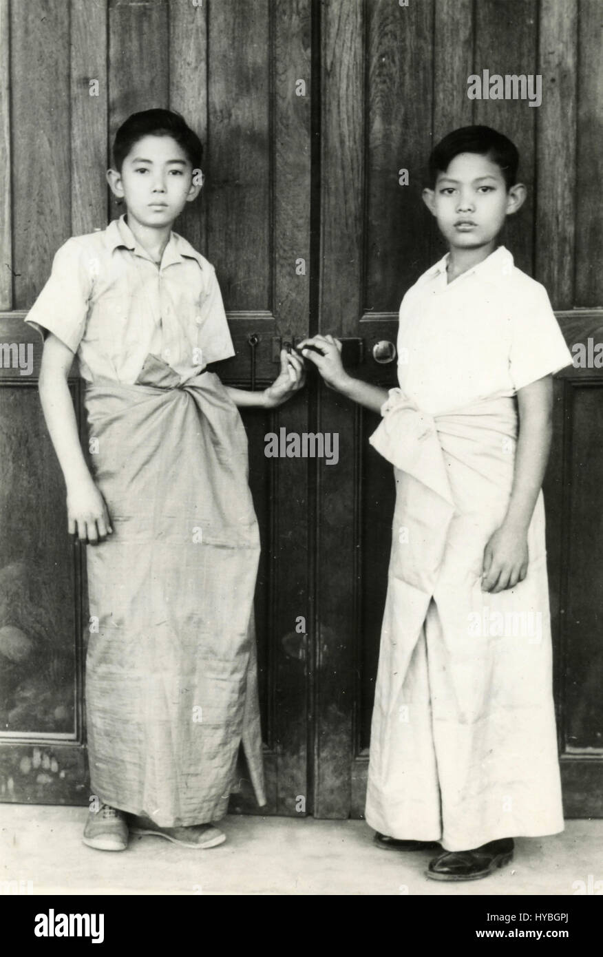 Two boys wearing traditional dress, Myanmar Stock Photo - Alamy