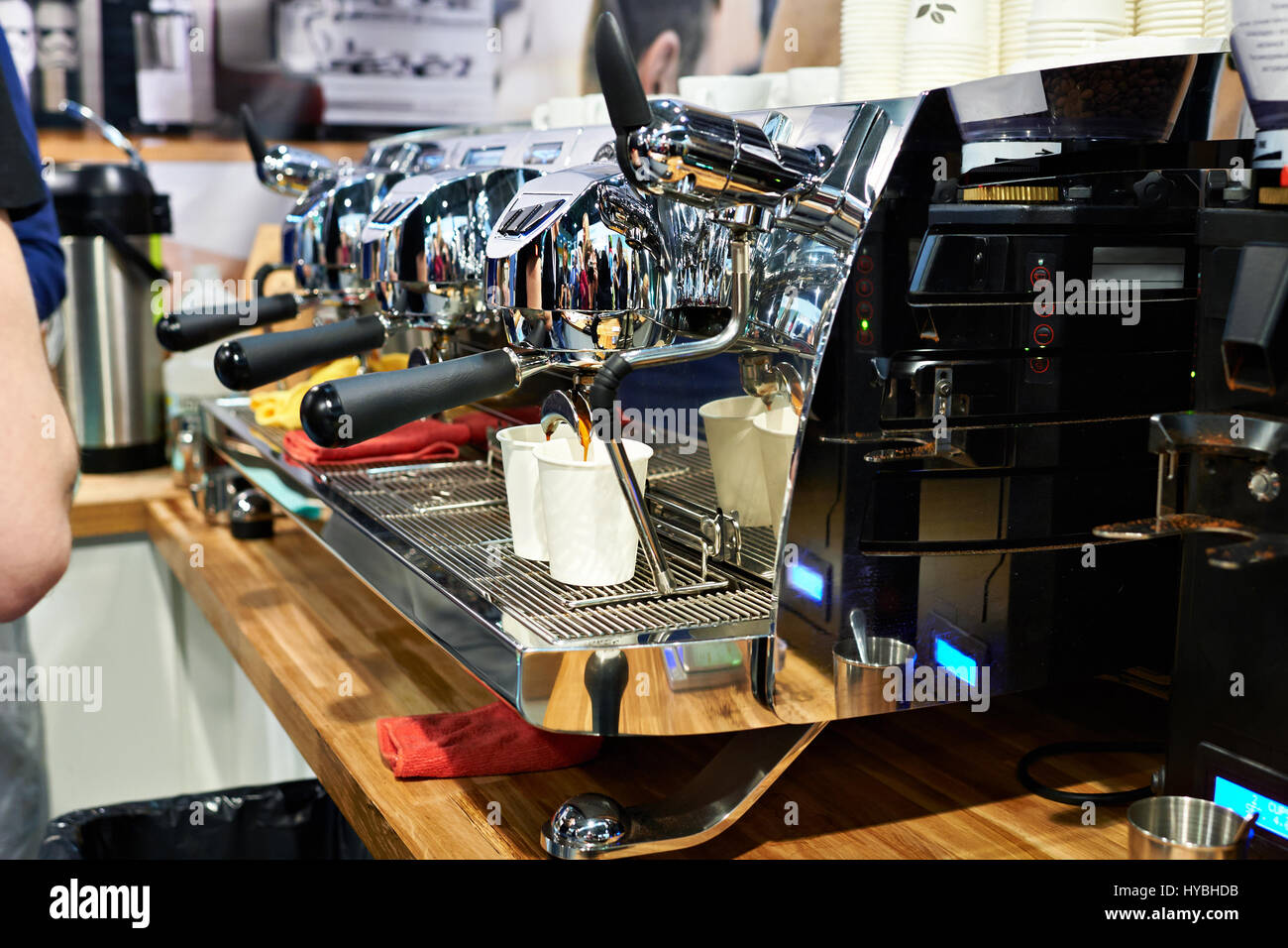 Large coffee machine pours two paper cups in cafe Stock Photo - Alamy