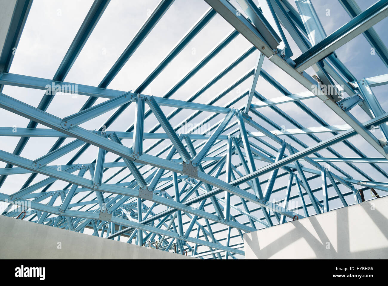 Structure of steel roof frame for building construction on sky ...