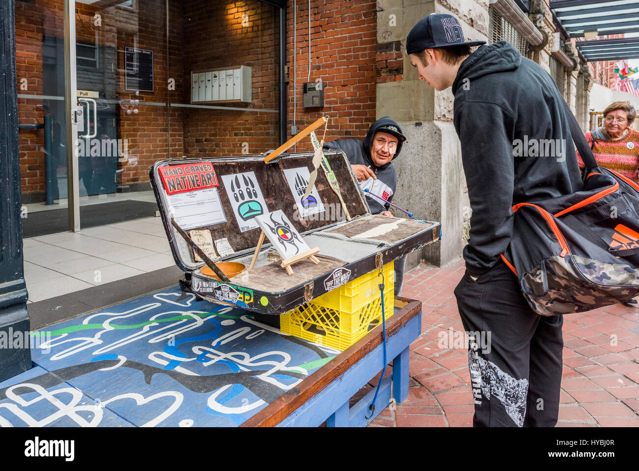 First Nations carver artist selling wares on sidewalk, Gastown ...
