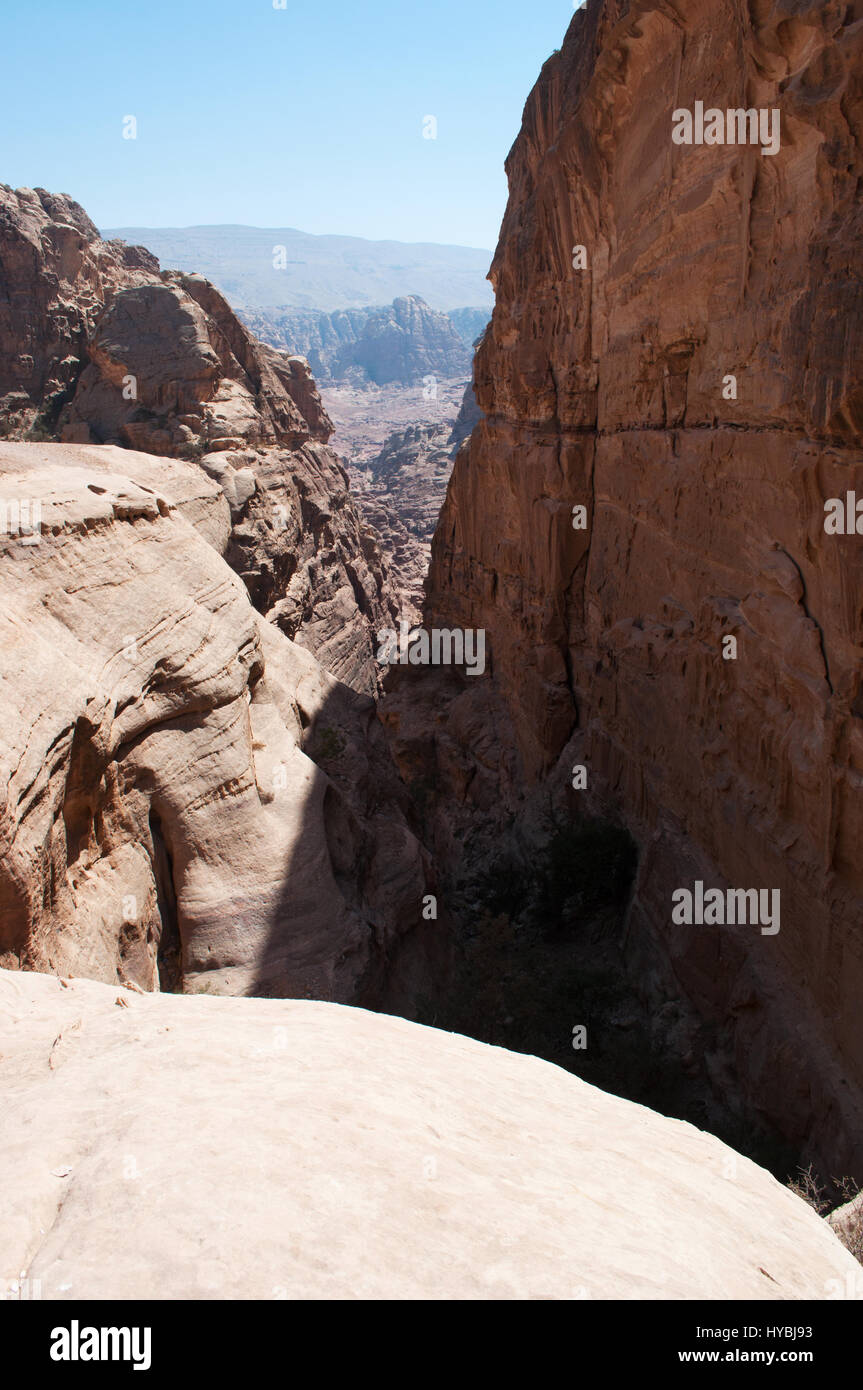 Jordanian landscape seen from a rock on the long way up on a dirt ...