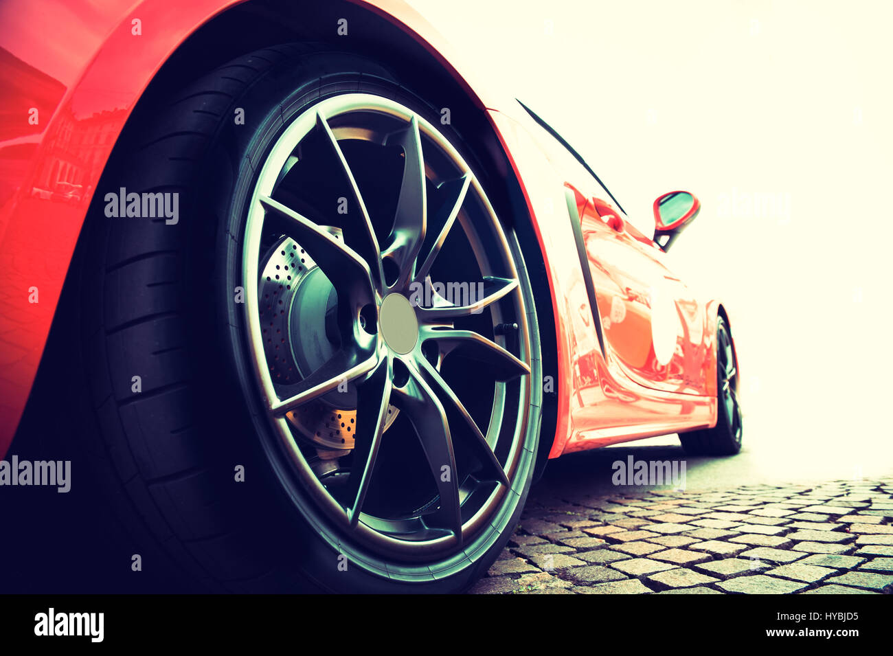 Back of a red modern sport car in sunset Stock Photo - Alamy